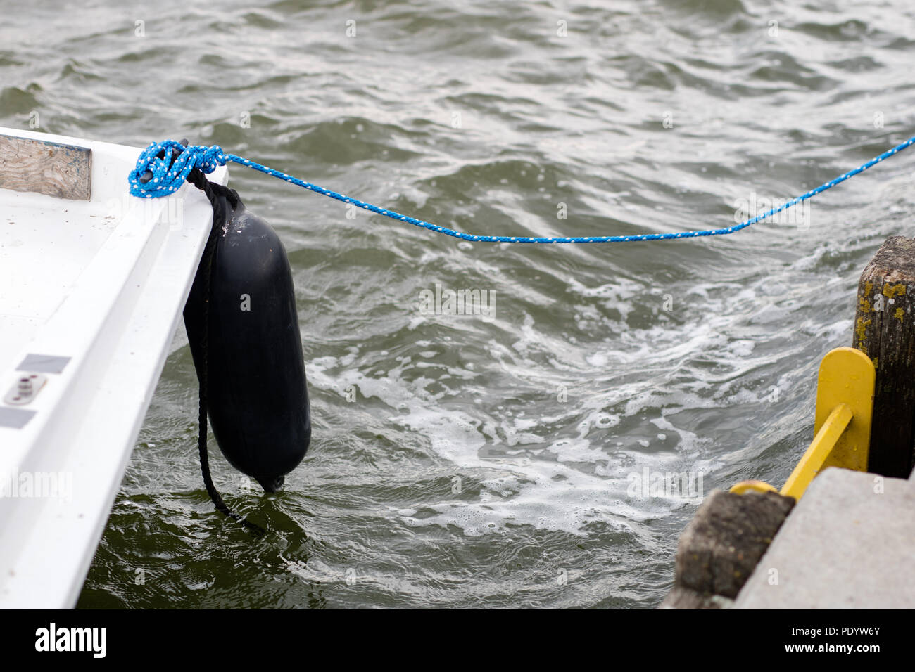 Hanging boat fenders hi-res stock photography and images - Alamy