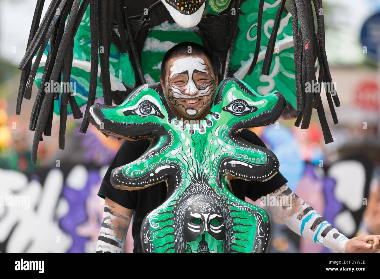 Cleveland, Ohio, USA - June 9, 2018 asian man wearing a colorful green ...