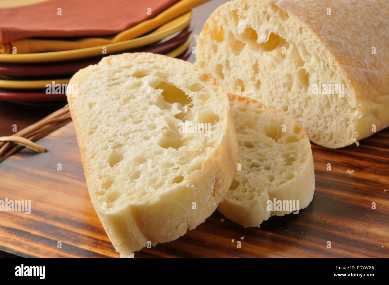 Sliced artisan bread on a cutting board Stock Photo - Alamy