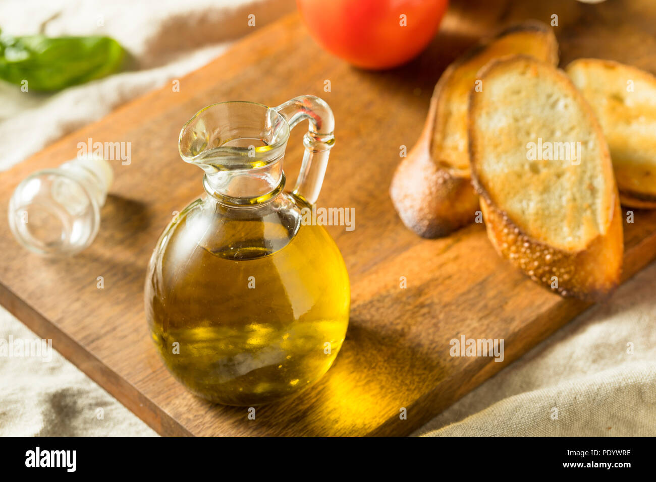 Raw Organic Extra Virgin Olive OIl in a Bottle Stock Photo - Alamy