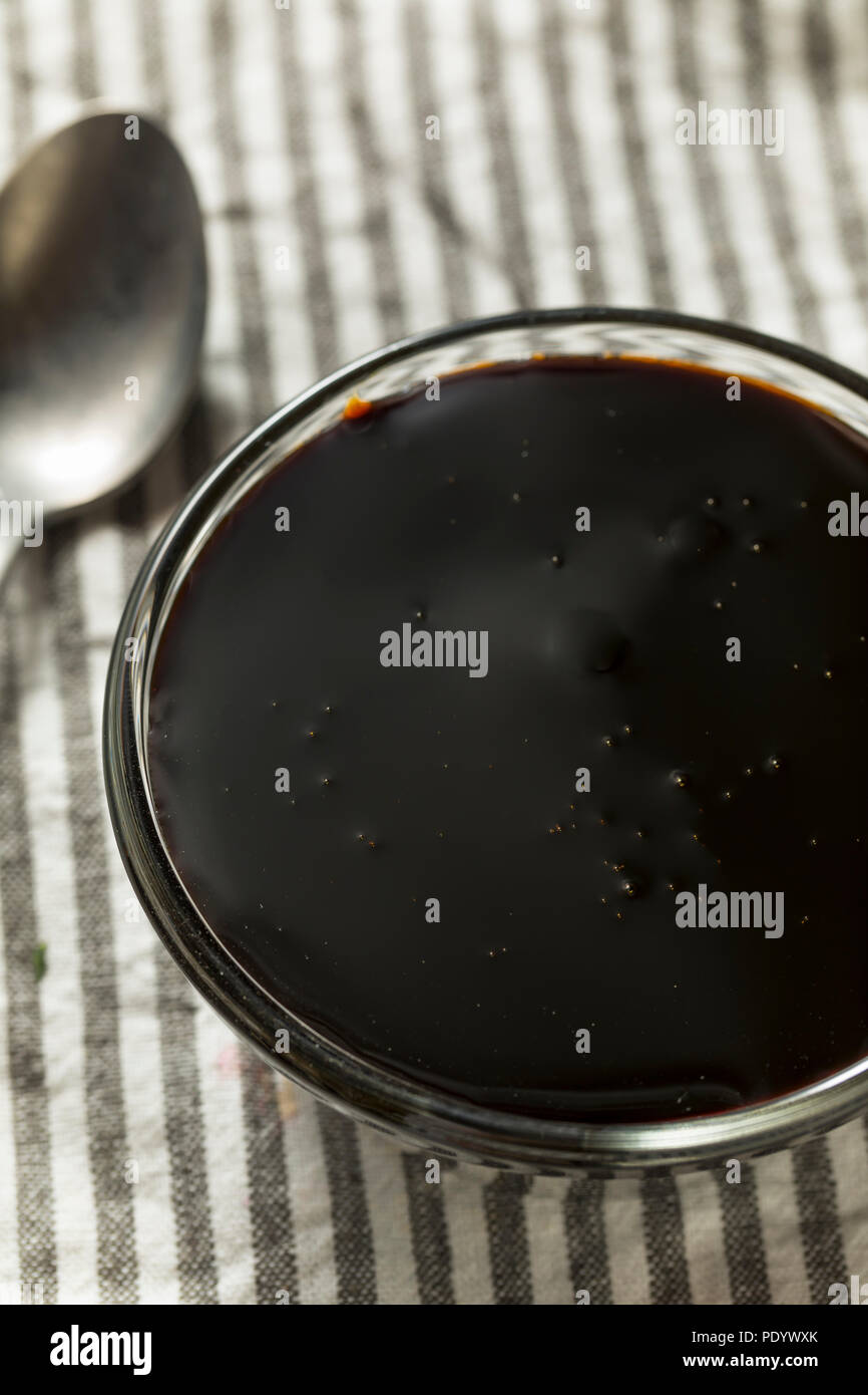 Organic Black Cane Sugar Molasses in a Bowl Stock Photo - Alamy