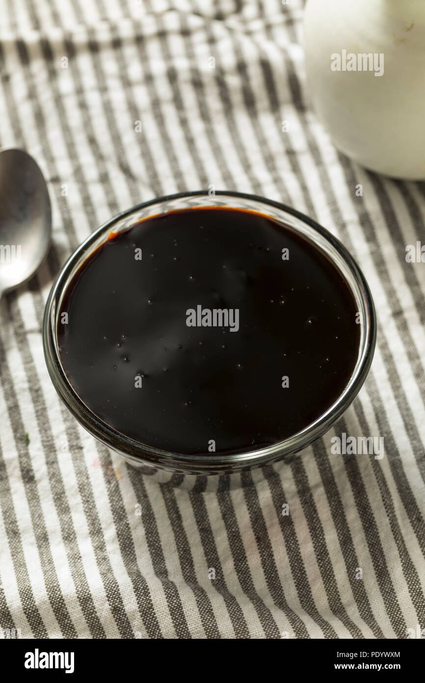 Organic Black Cane Sugar Molasses in a Bowl Stock Photo - Alamy