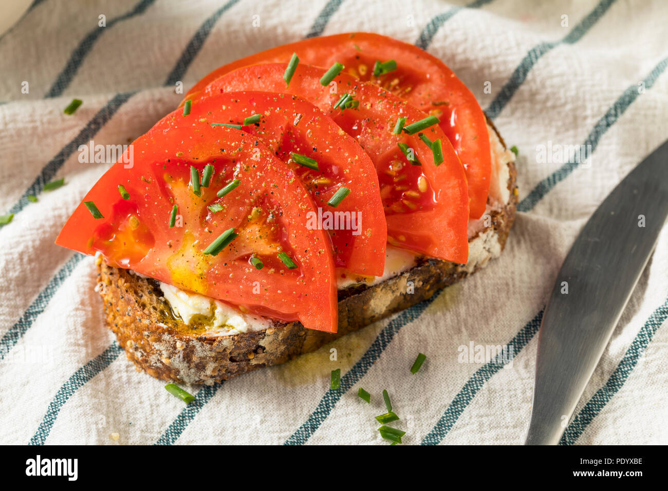 Trendy Homemade Tomato Toast with Goat Cheese and Chives Stock Photo ...