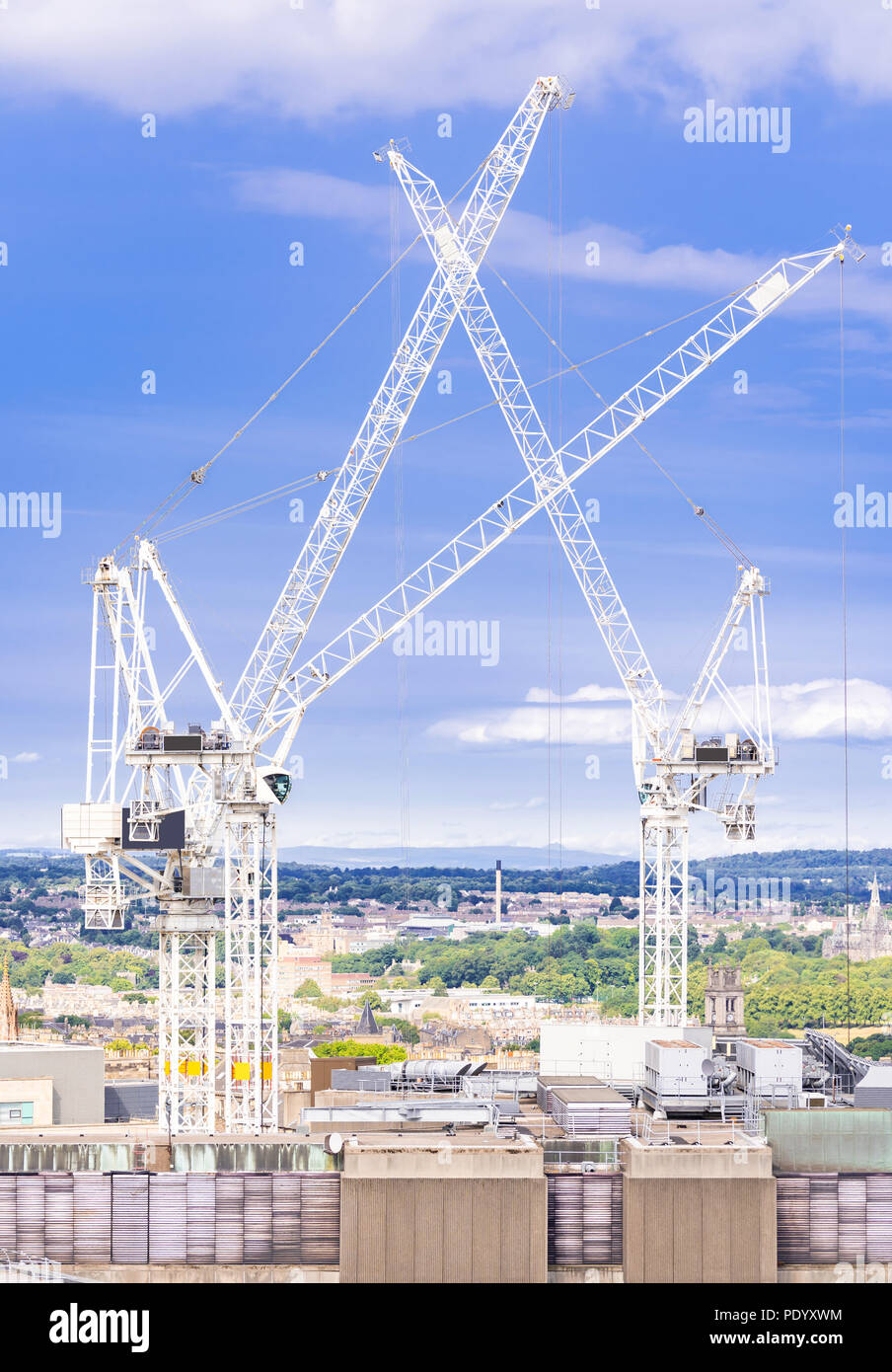 Construction crane working in construction site Stock Photo - Alamy