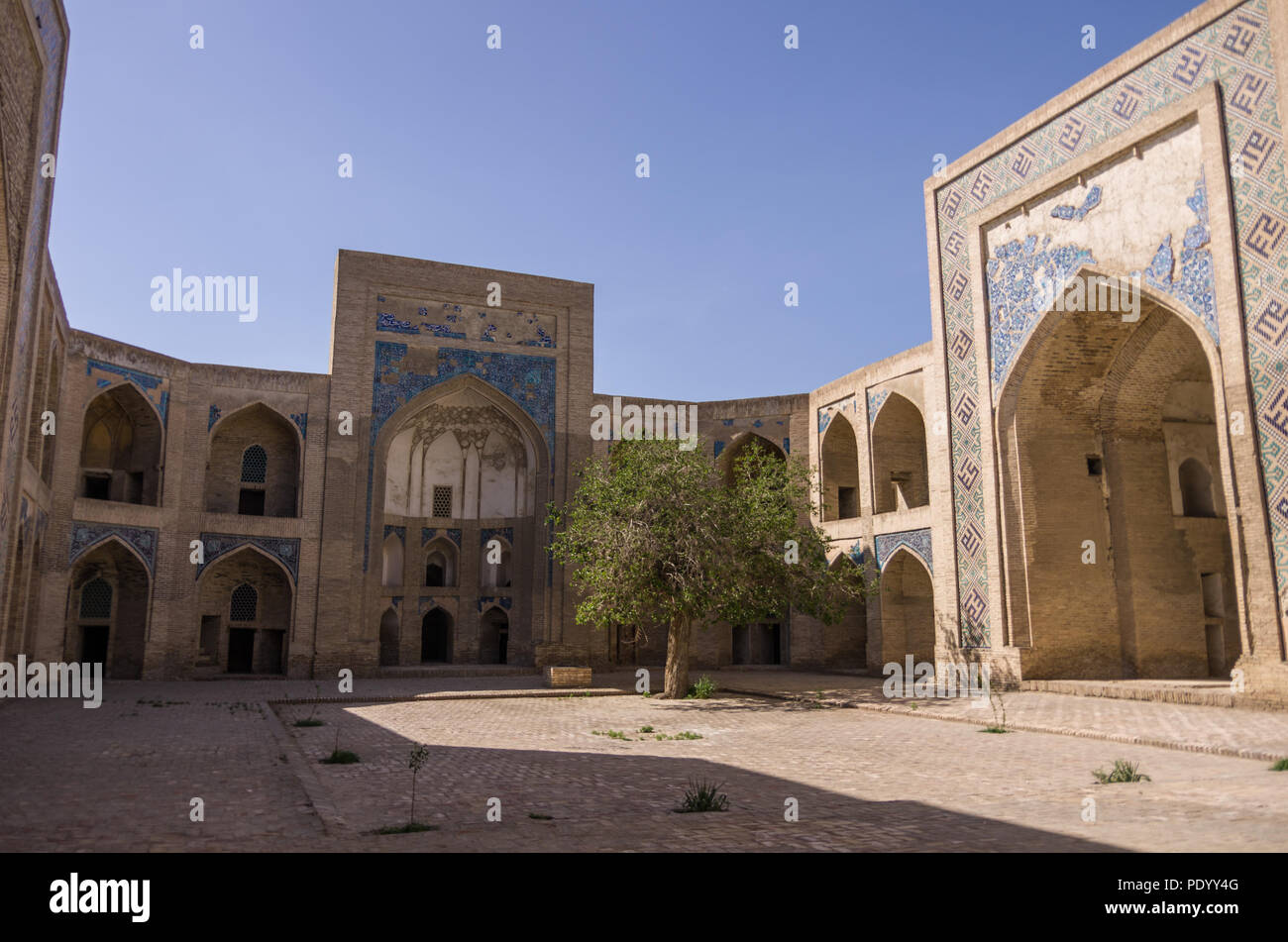 Courtyard of Abdullah-khan madrasah in Kosh-Madrasah complex. Bukhara ...
