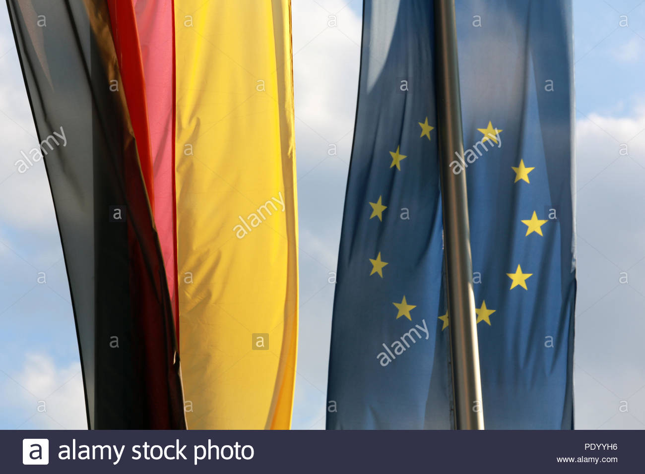 Two flags hanging side by side in germany hi-res stock photography and ...