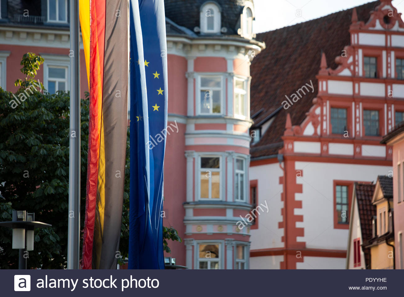 Two flags hanging side by side in germany hi-res stock photography and ...