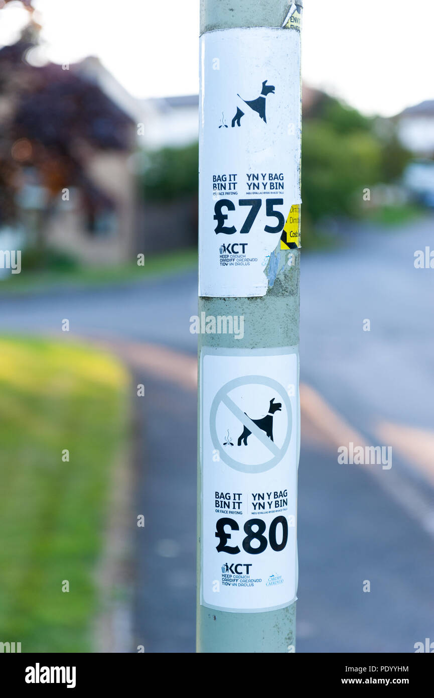 Council signs on a lamp post in South Wales, warning of penalties for ...