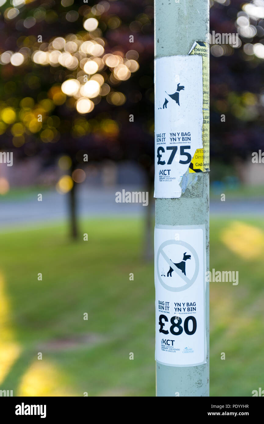 Council signs on a lamp post in South Wales, warning of penalties for ...