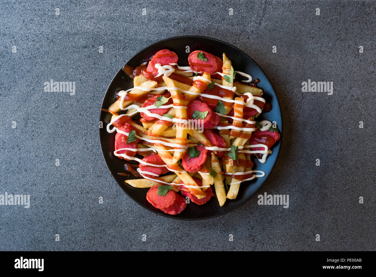 Homemade Peruvian Salchipapa Fries with Sausage Slices, Ketchup and ...
