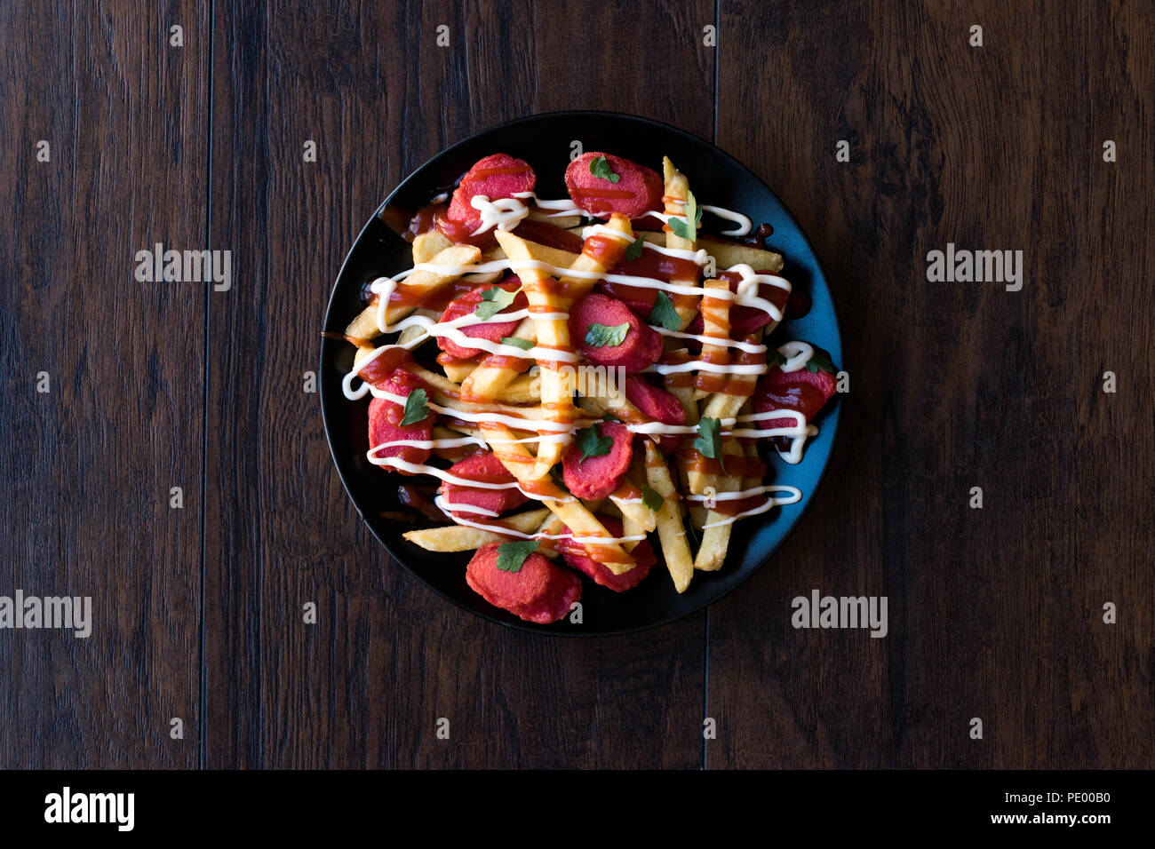 Homemade Peruvian Salchipapa Fries with Sausage Slices, Ketchup and ...