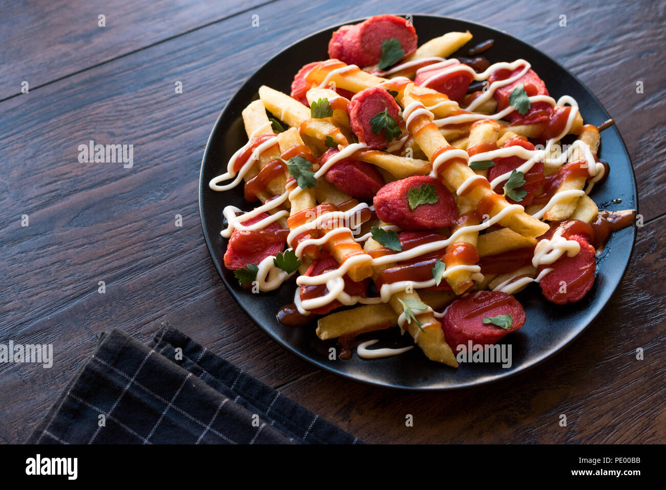 Homemade Peruvian Salchipapa Fries with Sausage Slices, Ketchup and ...