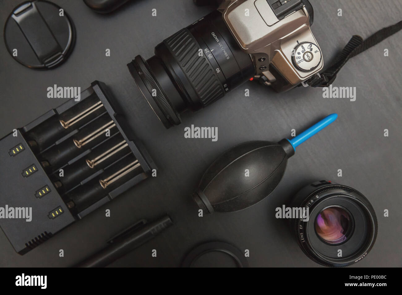 top view of work space photographer with dslr camera system, camera ...