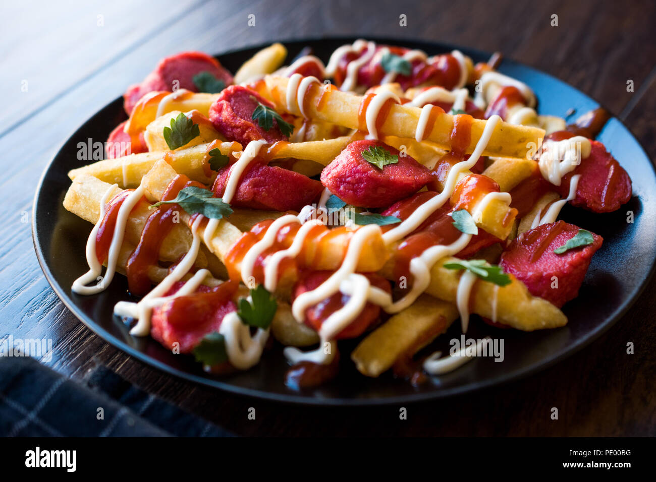 Homemade Peruvian Salchipapa Fries with Sausage Slices, Ketchup and ...