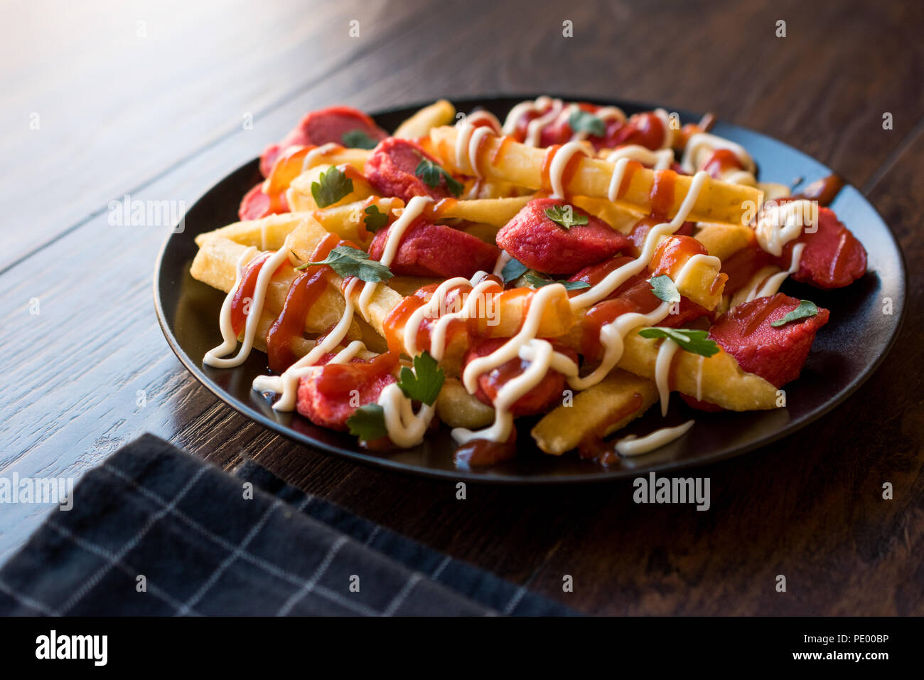 Homemade Peruvian Salchipapa Fries with Sausage Slices, Ketchup and ...