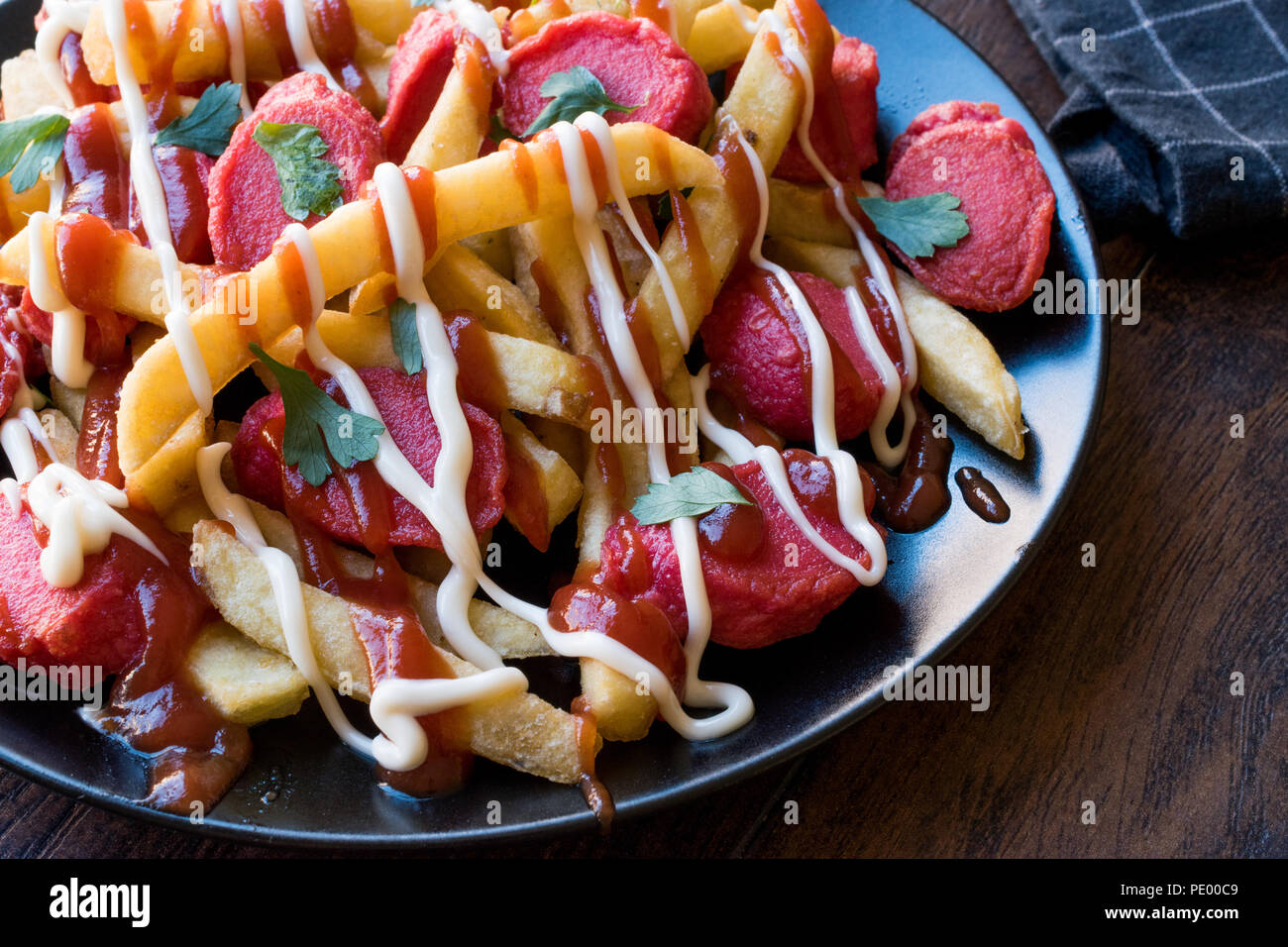 Homemade Peruvian Salchipapa Fries with Sausage Slices, Ketchup and ...