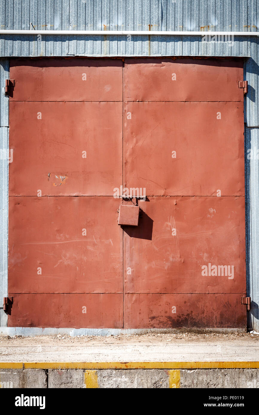 Old metal warehouse door, hangar gate. Industrial iron door Stock Photo ...