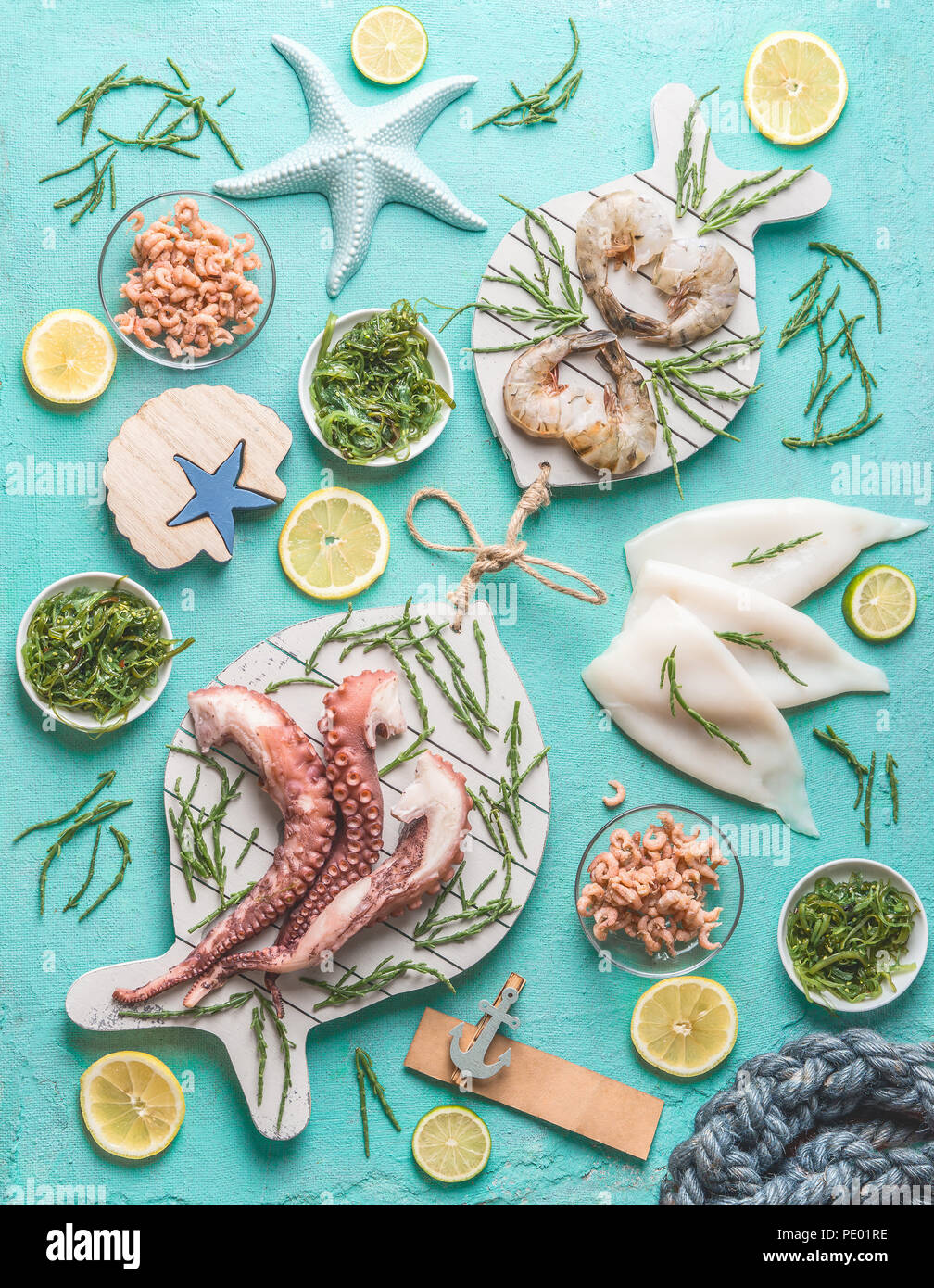 Seafood concept. Various seafood on light blue background, decorated ...