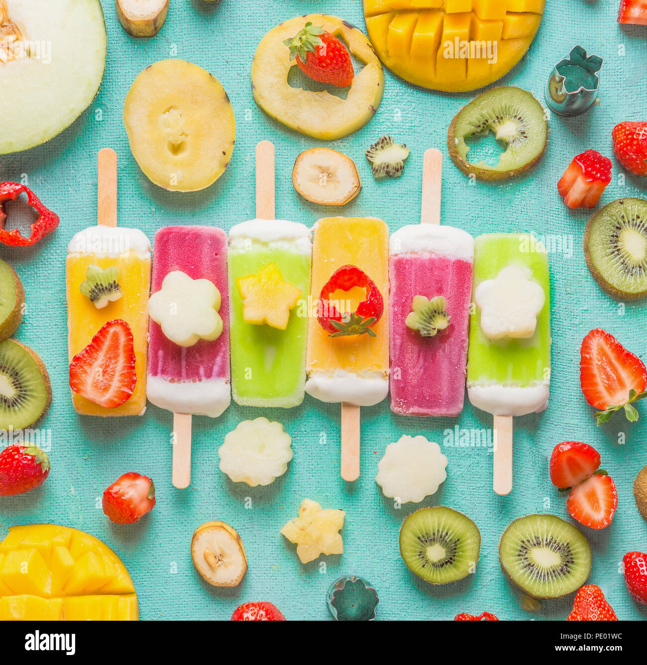 Colorful various Ice cream popsicles with fresh sliced fruits and ...