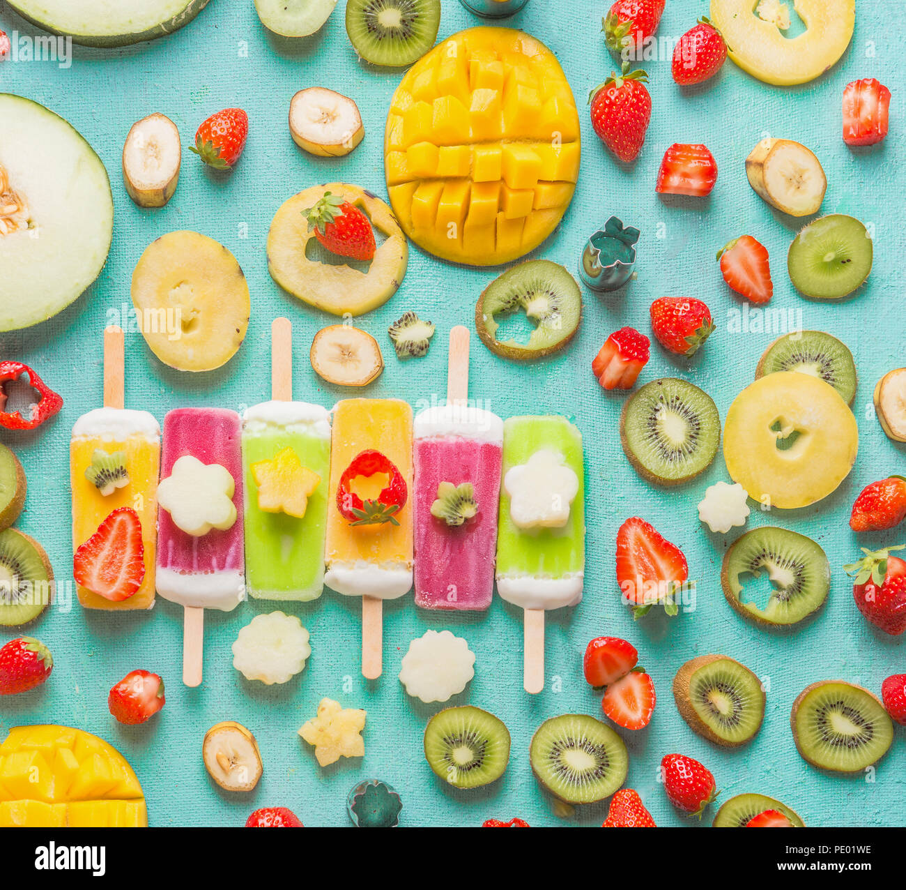 Colorful various Ice cream popsicles with fresh sliced fruits and ...