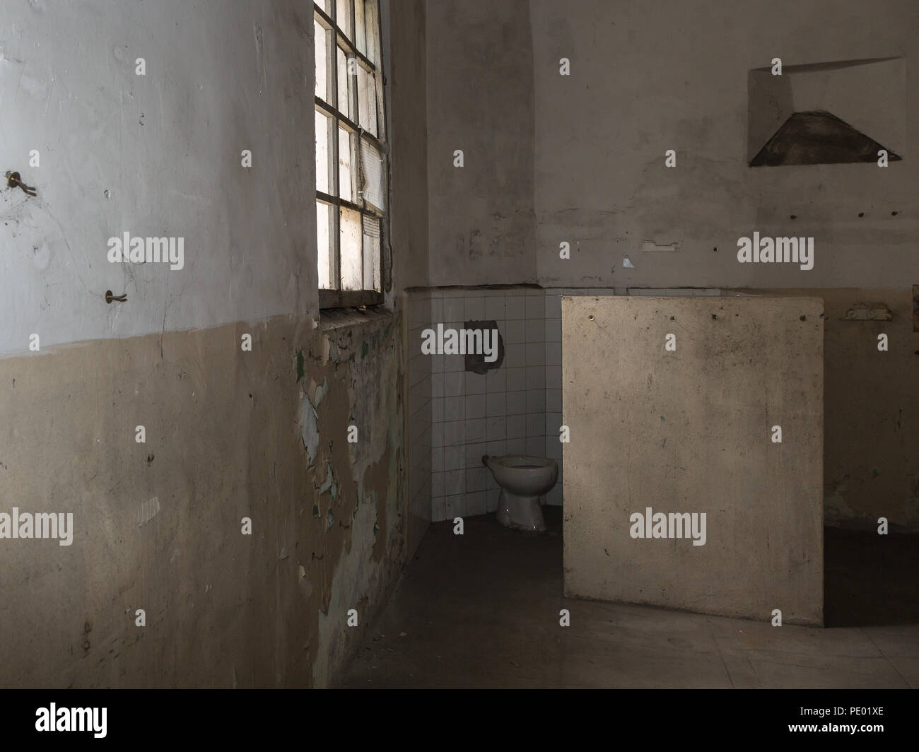 Empty Room with a Toilet in an Old Prison Stock Photo - Alamy