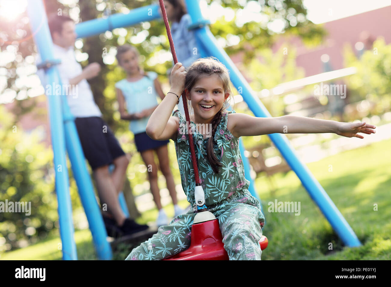 Joyful family having fun on playground Stock Photo - Alamy