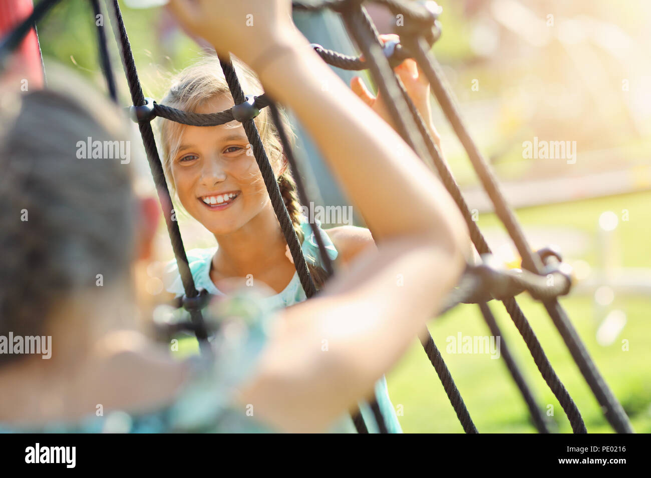 Joyful children having fun on playground Stock Photo - Alamy
