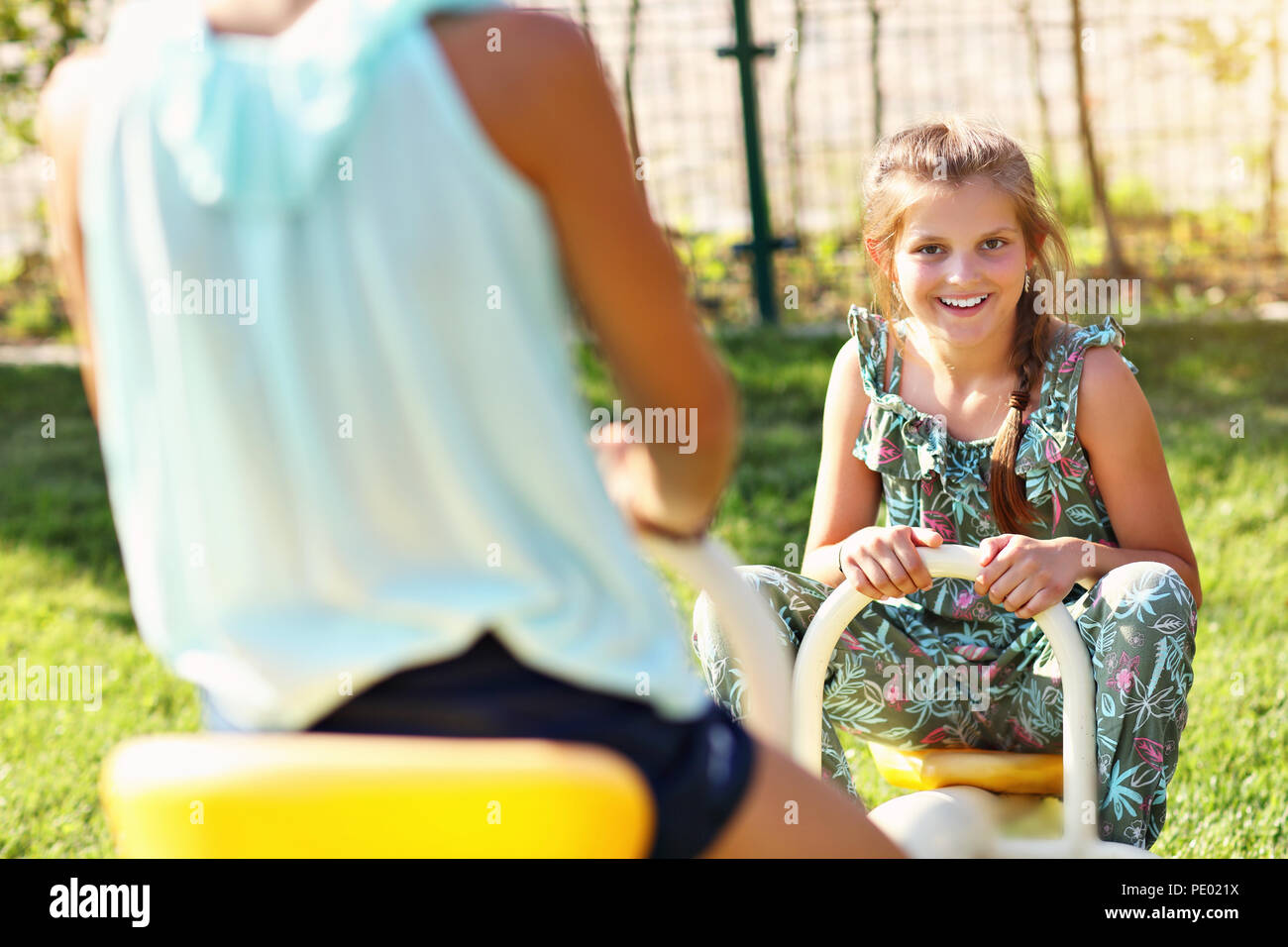 Joyful children having fun on playground Stock Photo - Alamy