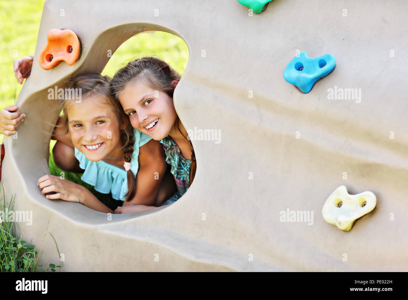 Joyful children having fun on playground Stock Photo - Alamy