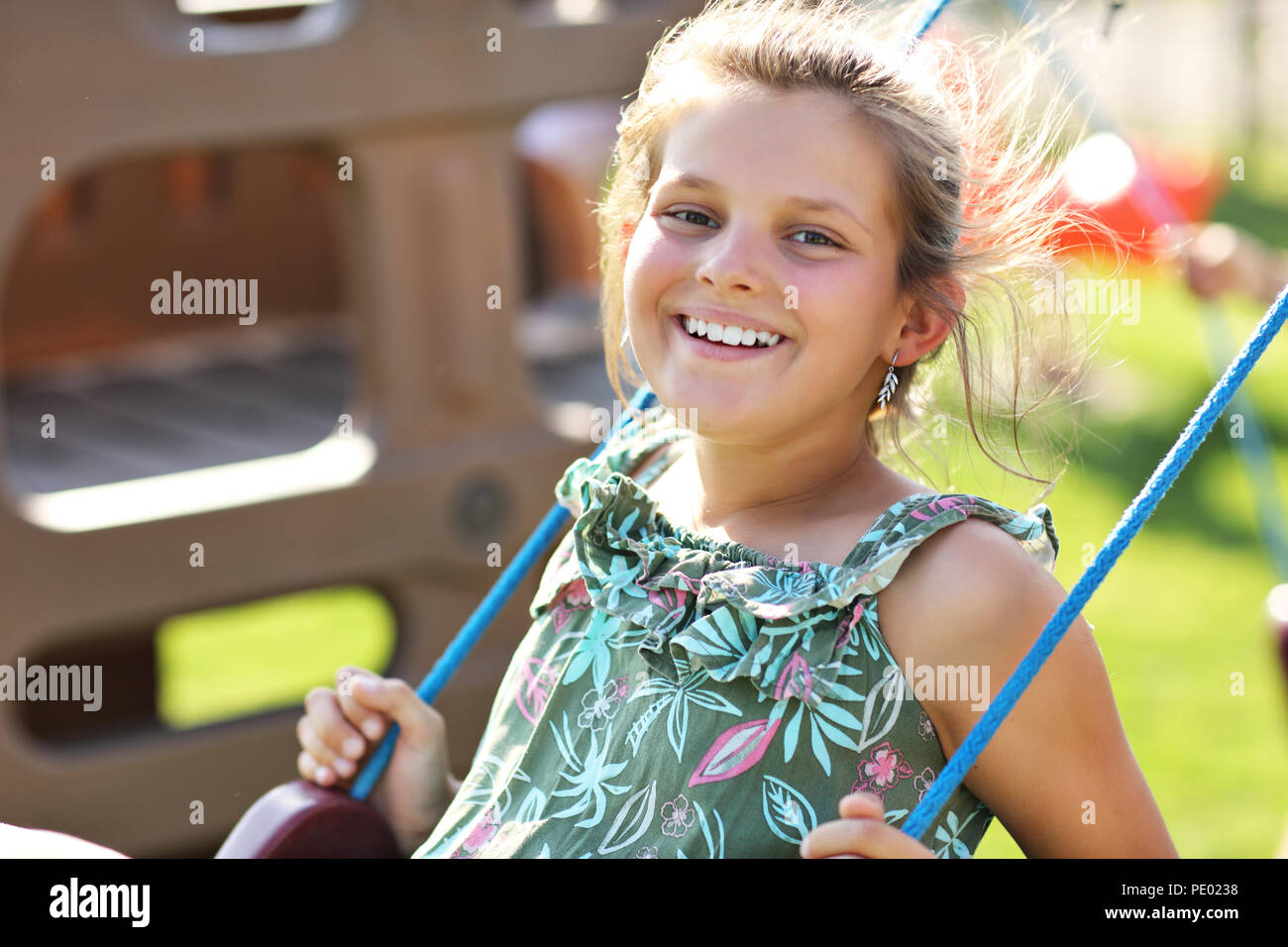 Child having fun on swing hi-res stock photography and images - Alamy
