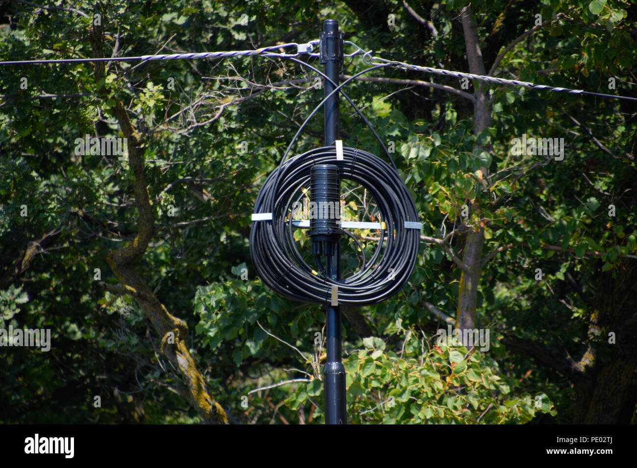 Power line post with a wound wire. The new wire is on the pole Stock ...