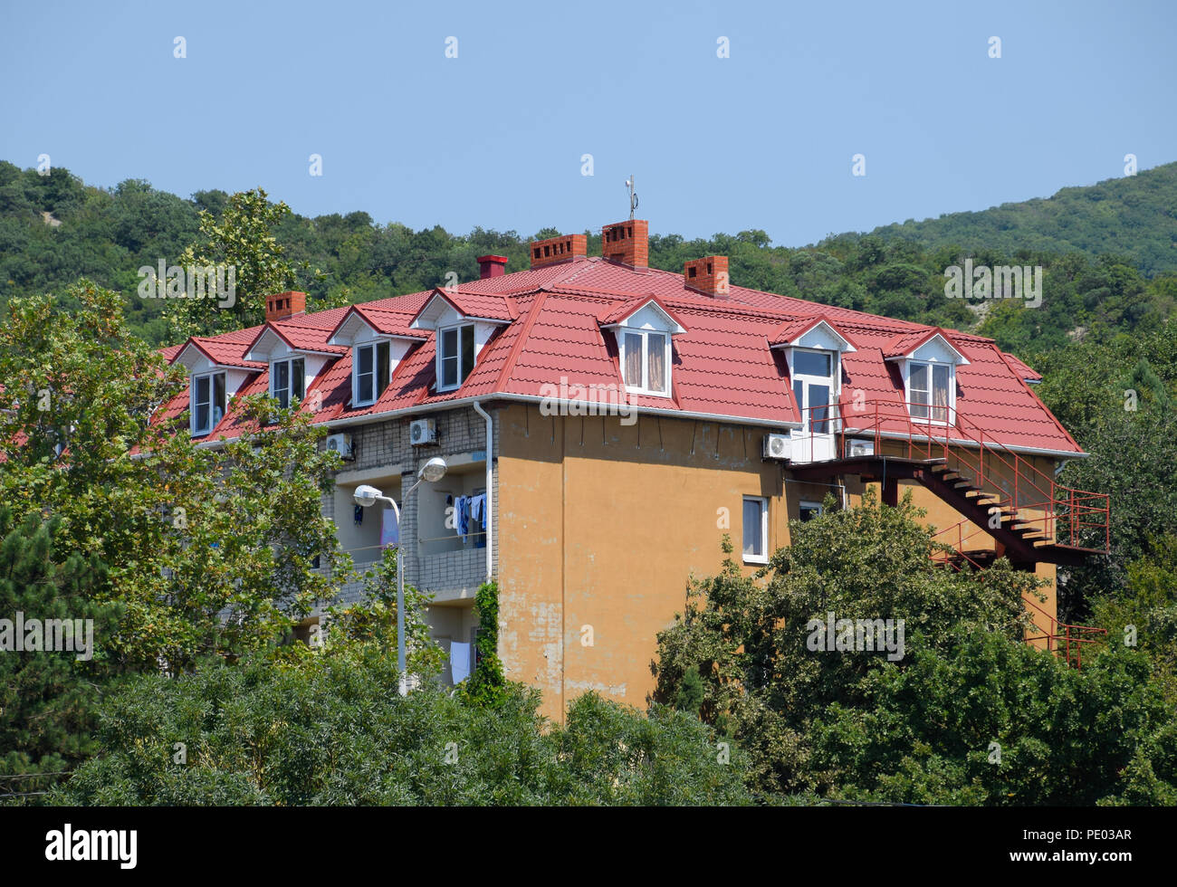 A multi-storey house on a mountain. Hotel for holidaymakers Stock Photo ...