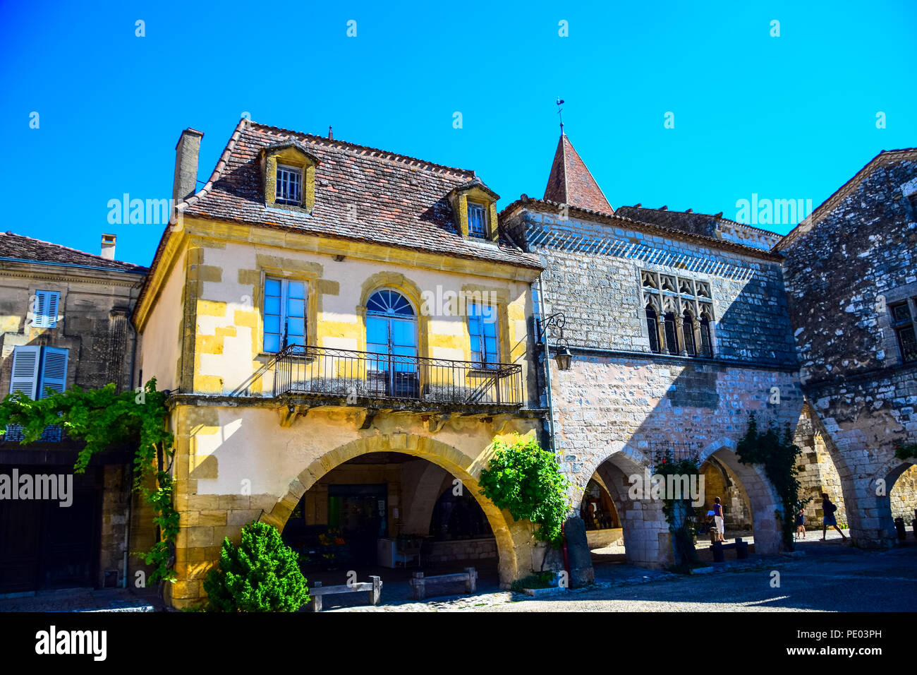 Central square in the medieval bastide village of Monpazier in the ...
