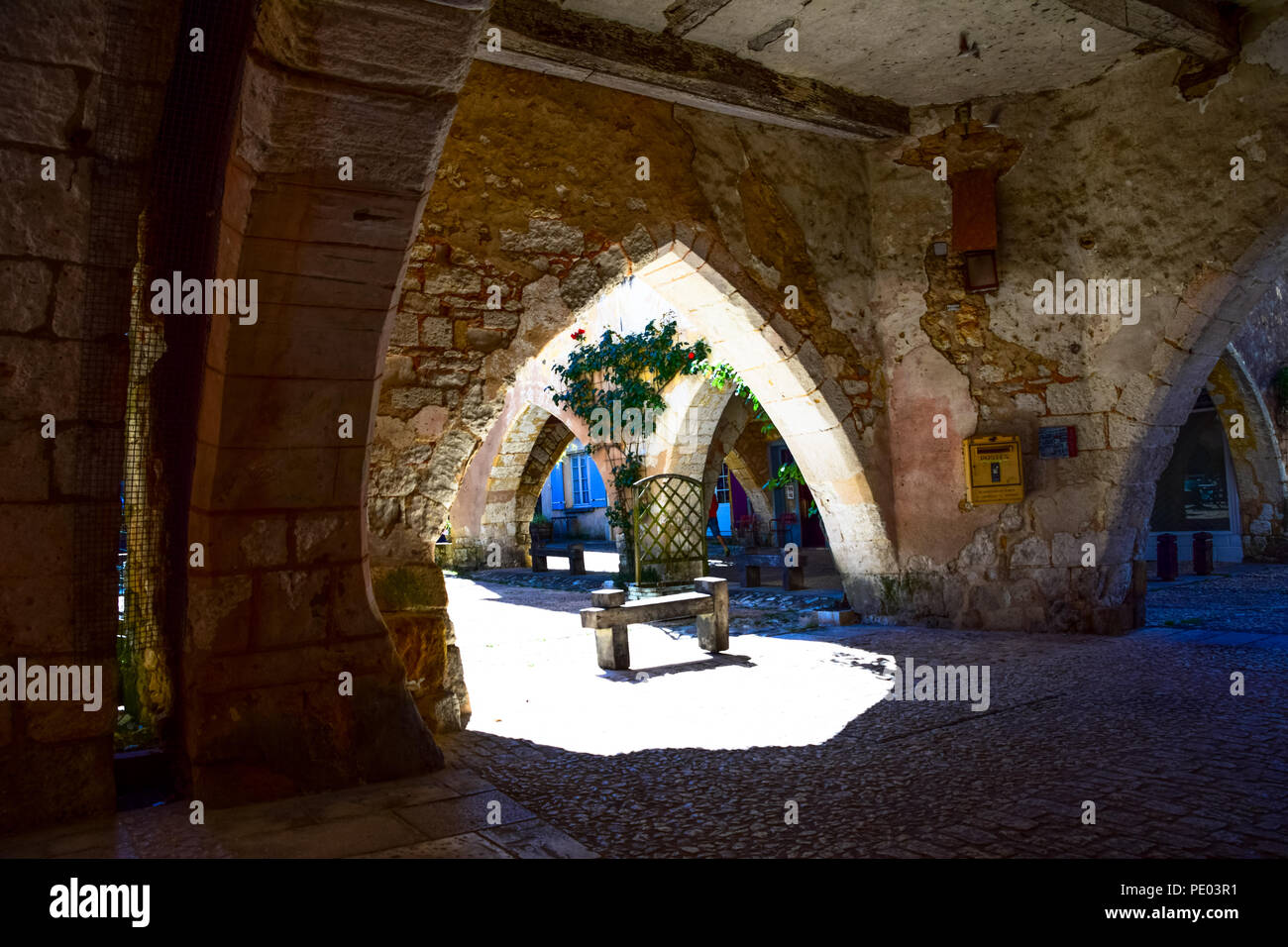 Central square in the medieval bastide village of Monpazier in the ...