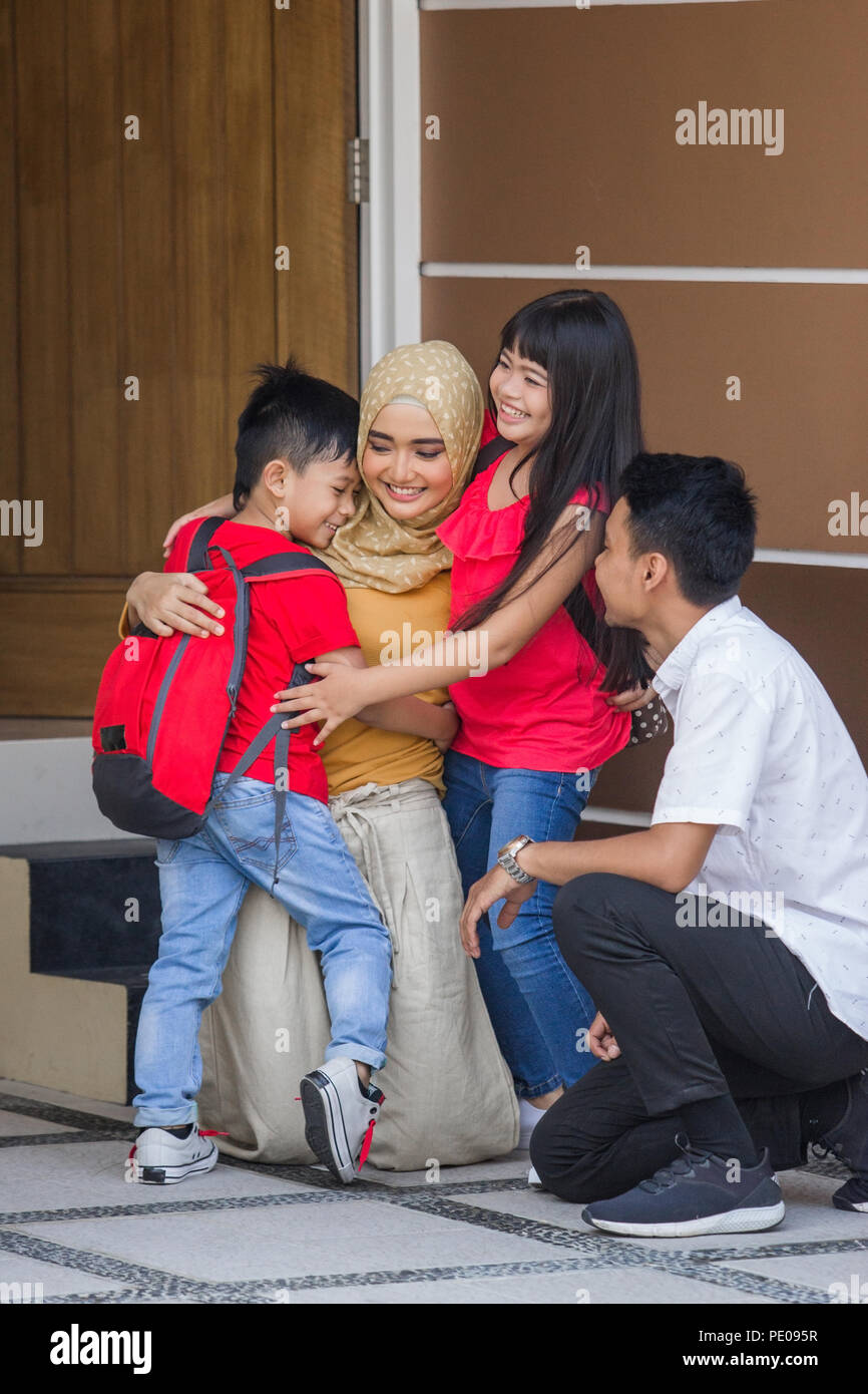 asian kid boy and girl hug their parents before going school Stock ...