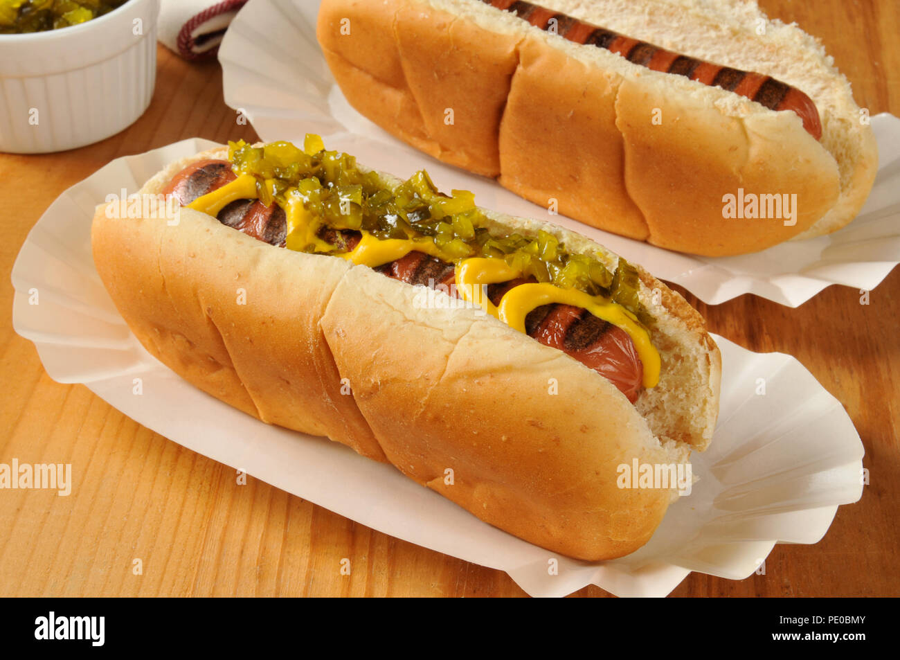 Grilled hot dogs with relish and mustard Stock Photo - Alamy