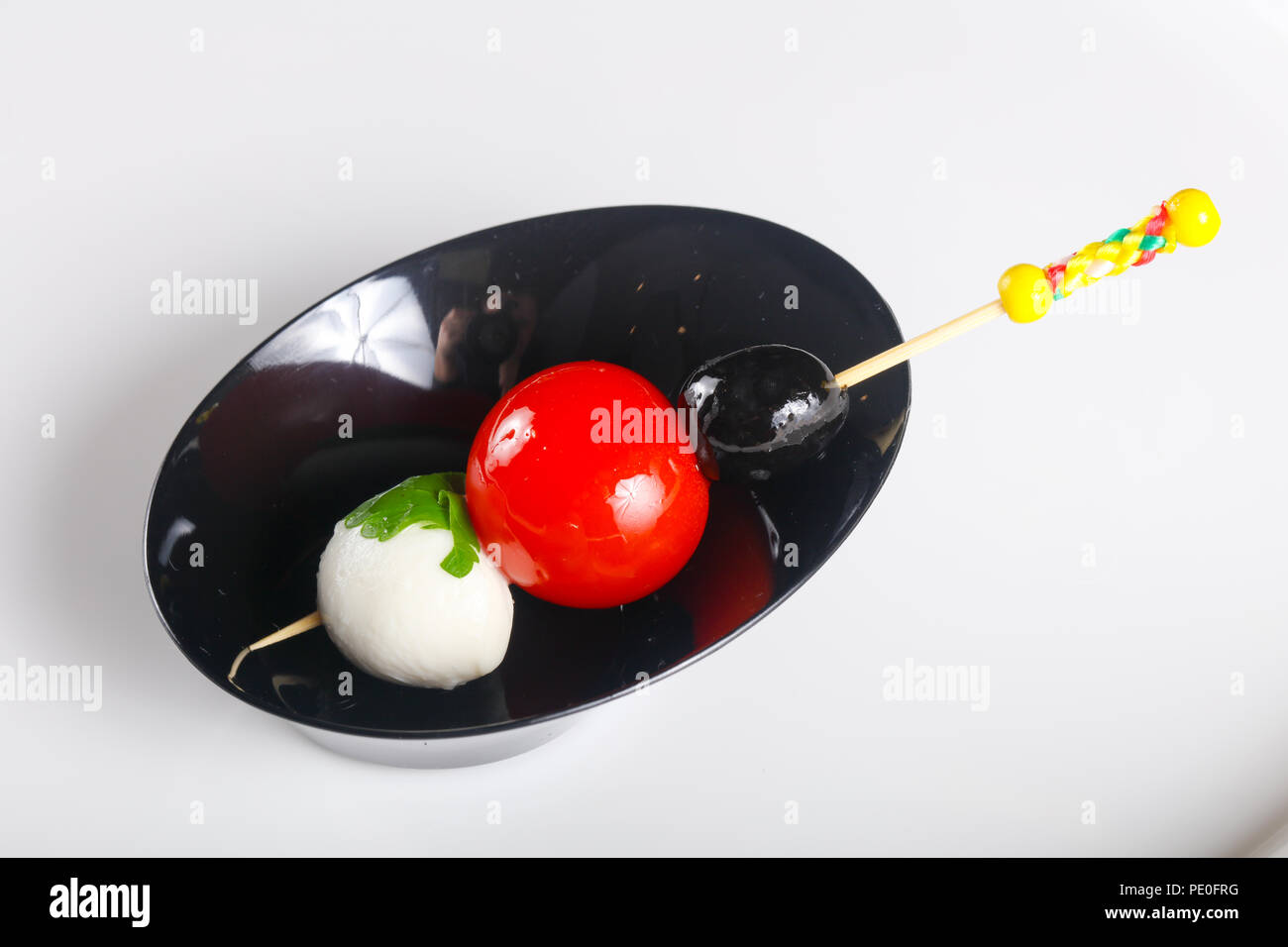 Canape with tomato and mozarella cheese Stock Photo - Alamy