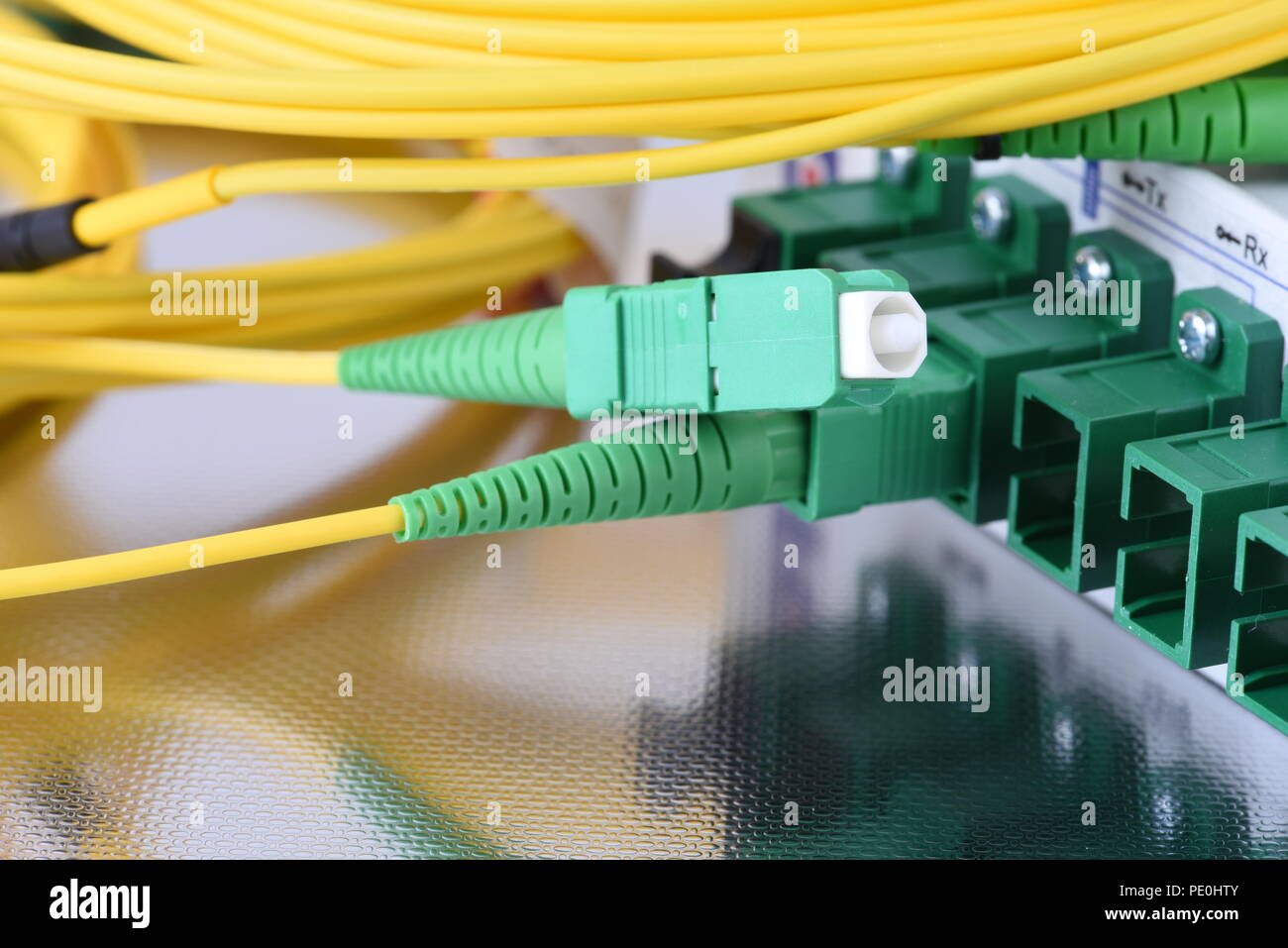 Fiber optical network cables connected to equipment in data center ...
