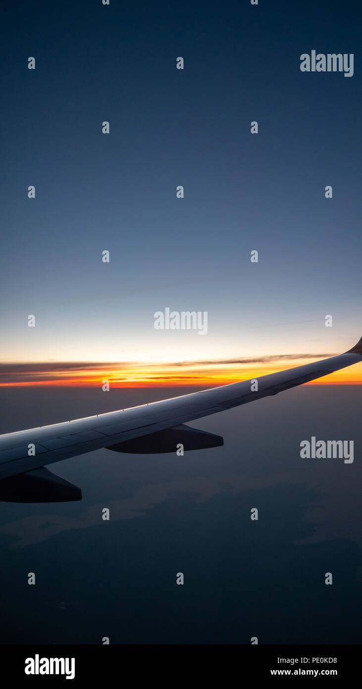 Right Airplane Wing With Sunrise on the background and Open space on ...