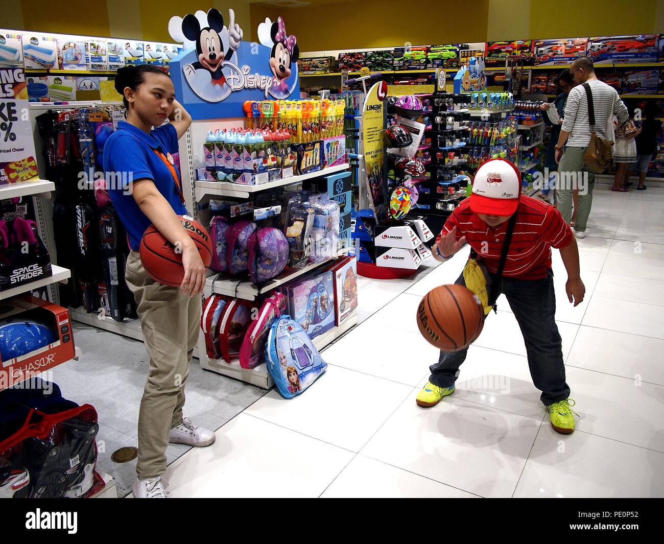 MANDALUYONG CITY, PHILIPPINES: AUGUST 5, 2018: A young boy plays with a ...