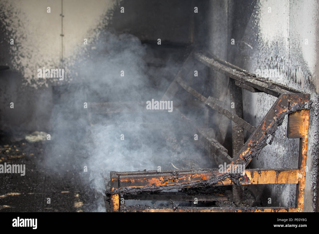 chair and furniture in house after burned with smoke and dust in burn ...