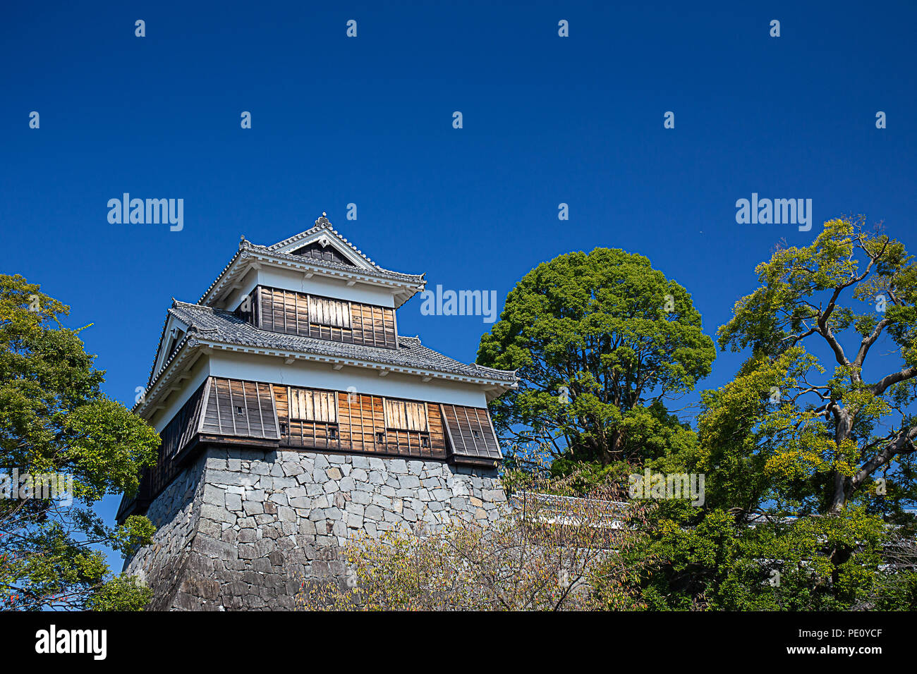 wooden turret or yagura on stone wall of Kumamoto castle in Japan and ...