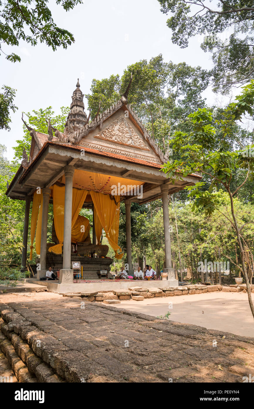 Buddhist temple Wat Preah Ngok with a large sandstone statue of the ...