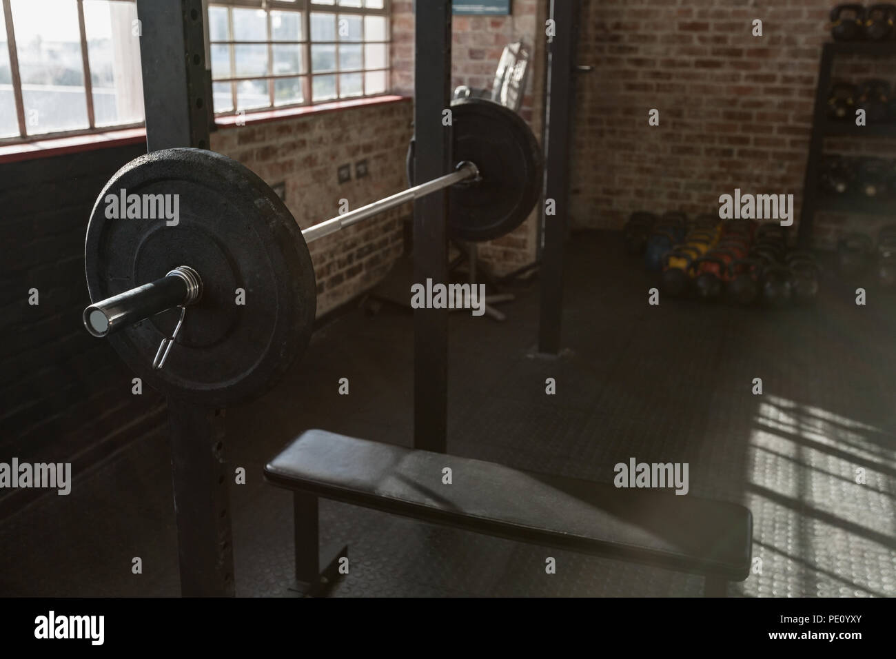 Barbell in the fitness studio Stock Photo - Alamy