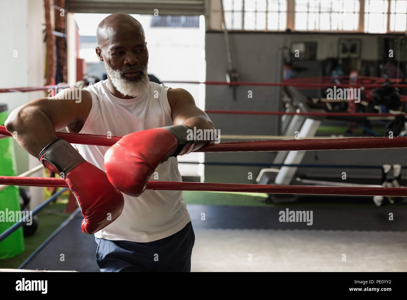 Senior man standing in the boxing ring Stock Photo - Alamy