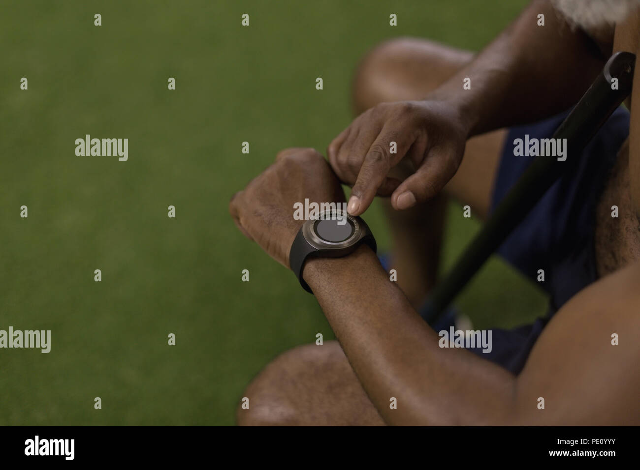 Man checking his smart watch Stock Photo - Alamy
