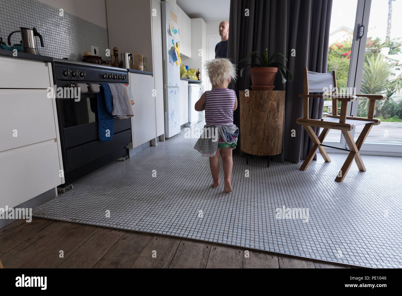 Adult and child walking to house hi-res stock photography and images ...