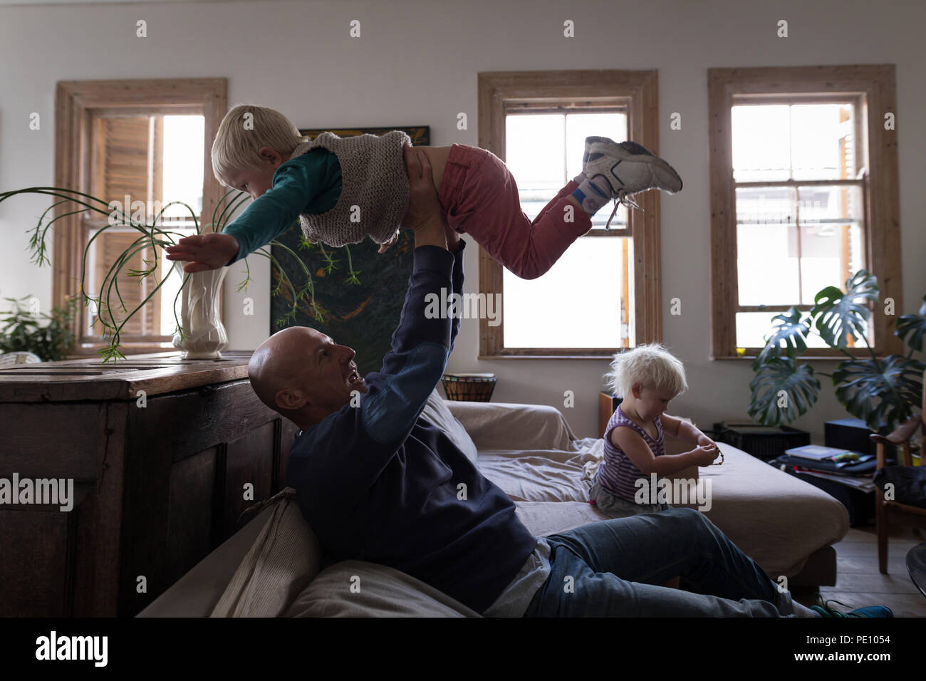 Father kids sofa hi-res stock photography and images - Alamy