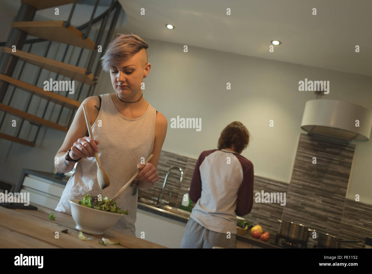 Beautiful woman preparing food in hi-res stock photography and images ...