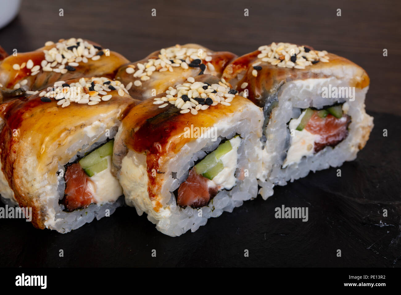 Tasty eel sushi with sesame and teriyaki Stock Photo - Alamy